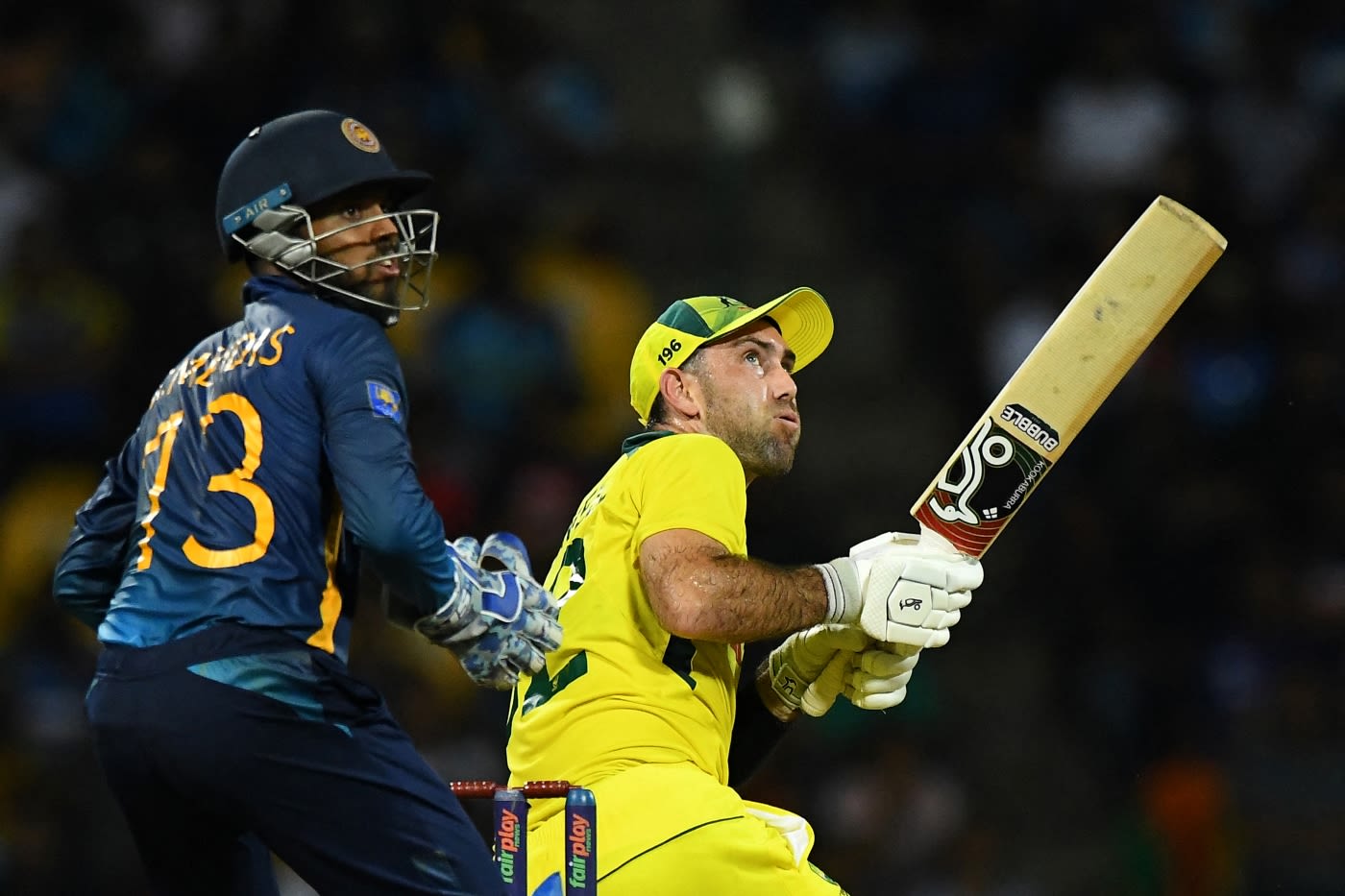 Glenn Maxwell watches a reverse-sweep soar into the night sky | ESPNcricinfo.com