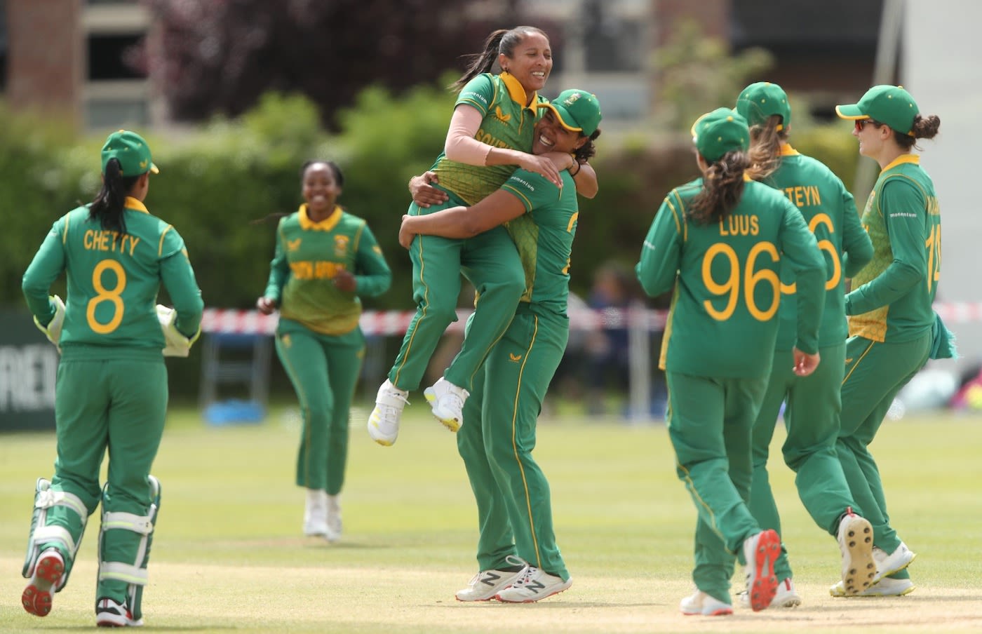 Chloe Tryon picks up Shabnim Ismail as their team-mates gather around ...