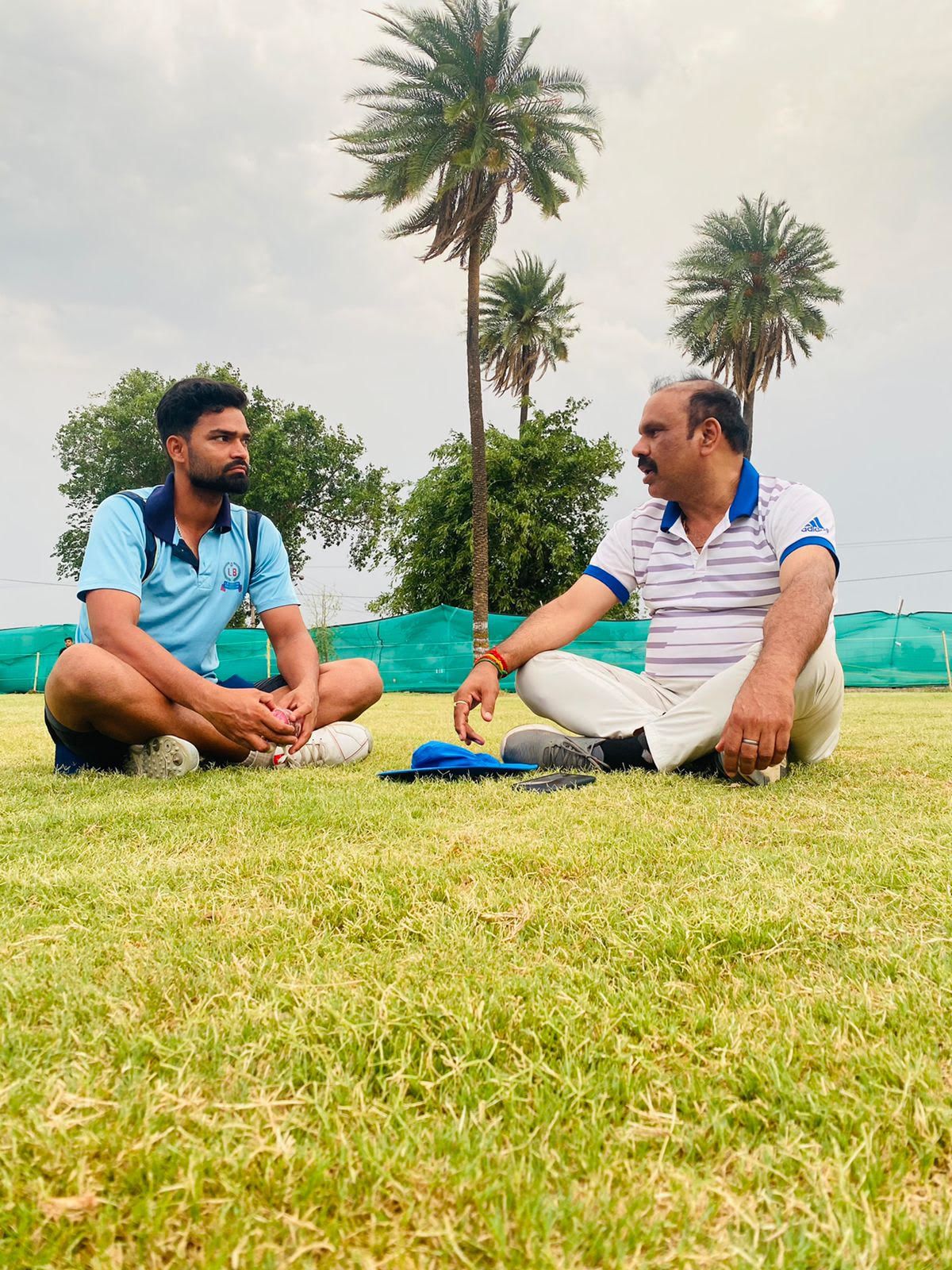 Kumar Kartikeya (left) chats with coach Sanjay Bhardwaj during training ...