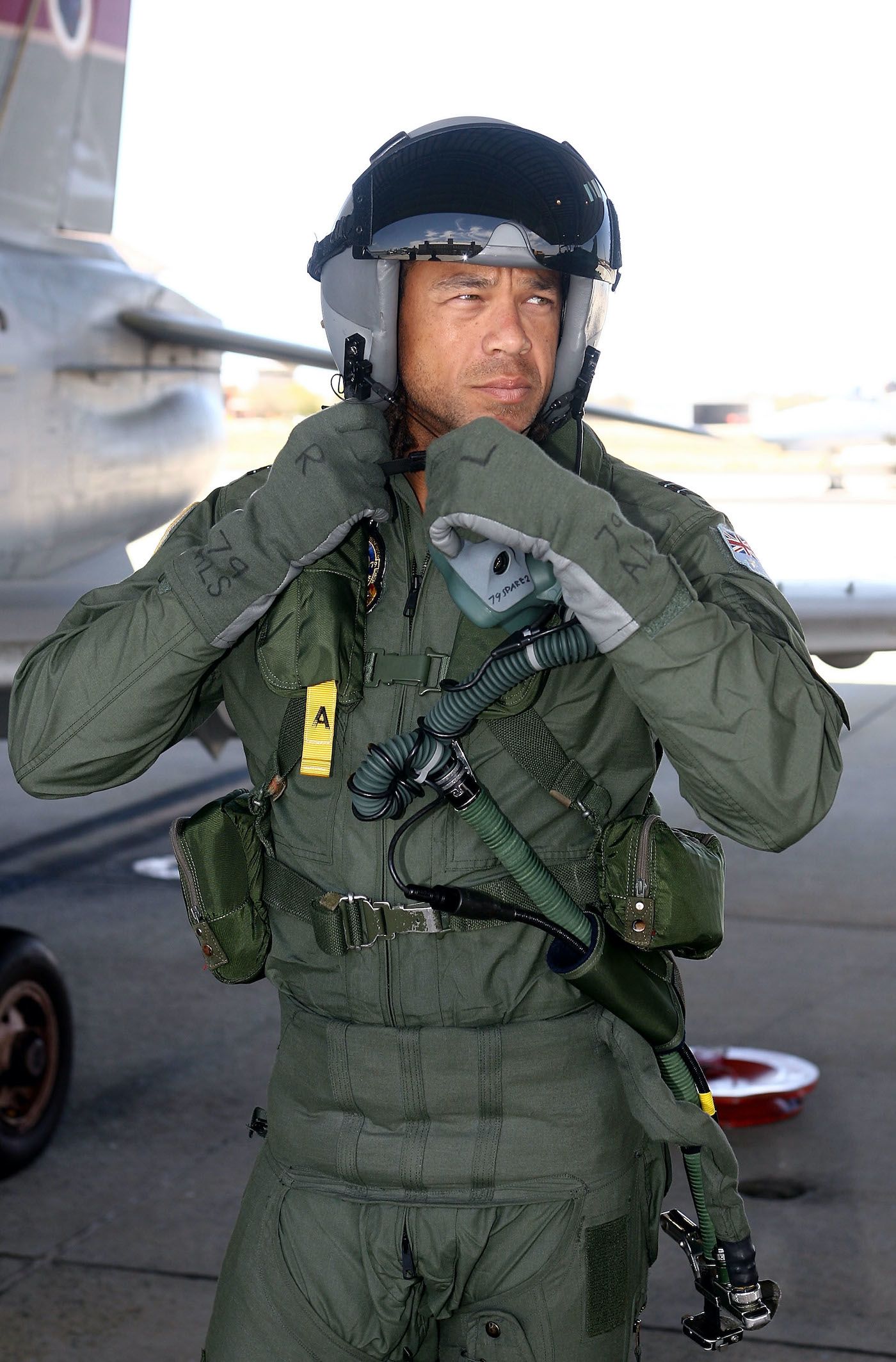 Andrew Symonds prepares to remove his helmet after his flight in a Hawk ...