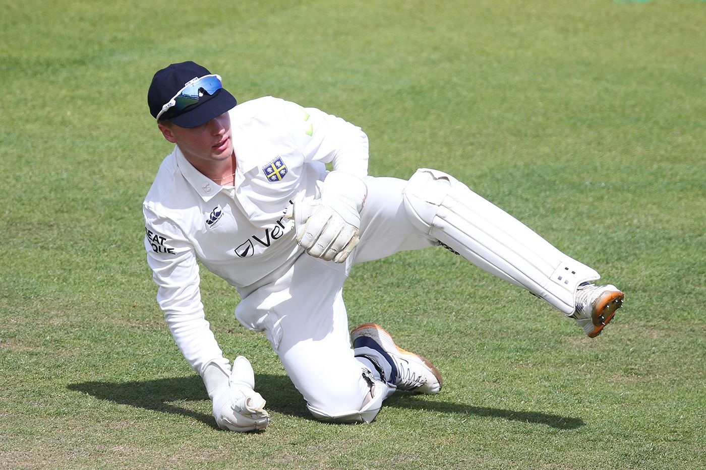 Tom Mackintosh, pictured while keeping wicket, is on first-class debut ...