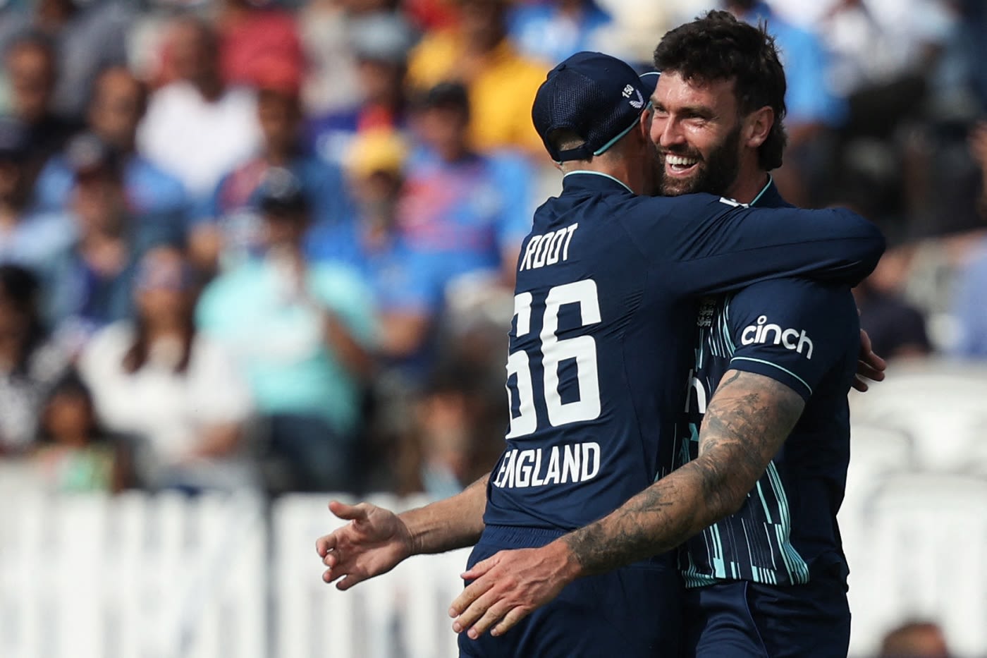 Reece Topley celebrates with Joe Root | ESPNcricinfo.com