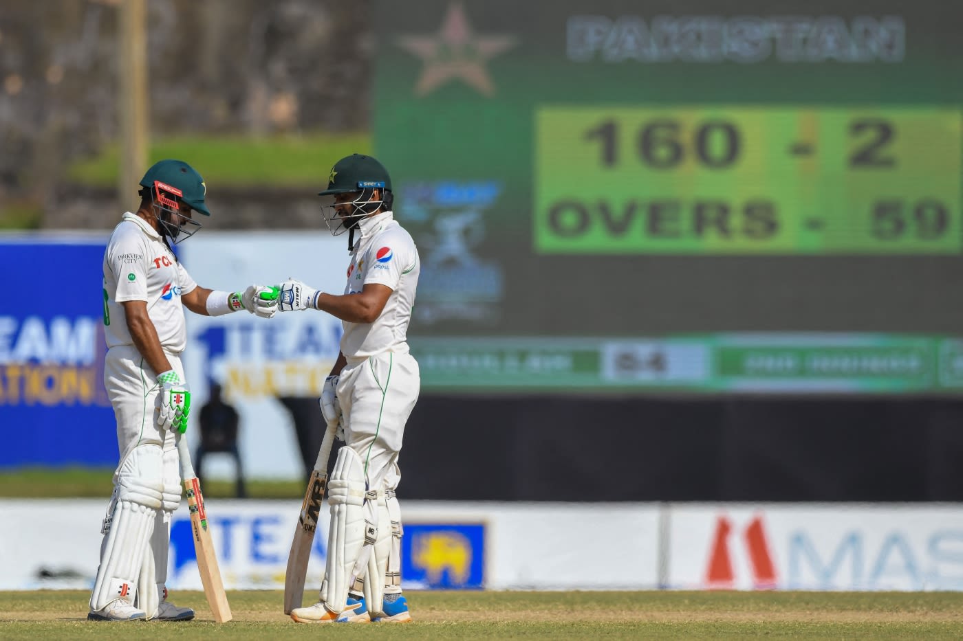 Babar Azam and Abdullah Shafique steered Pakistan into a solid position ...