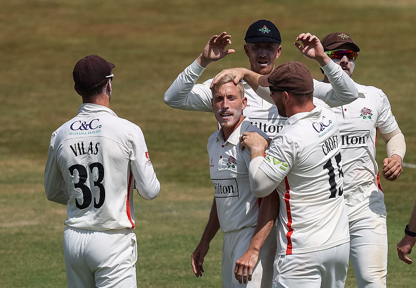 Luke Wood celebrates with his team-mates after taking the wicket of ...