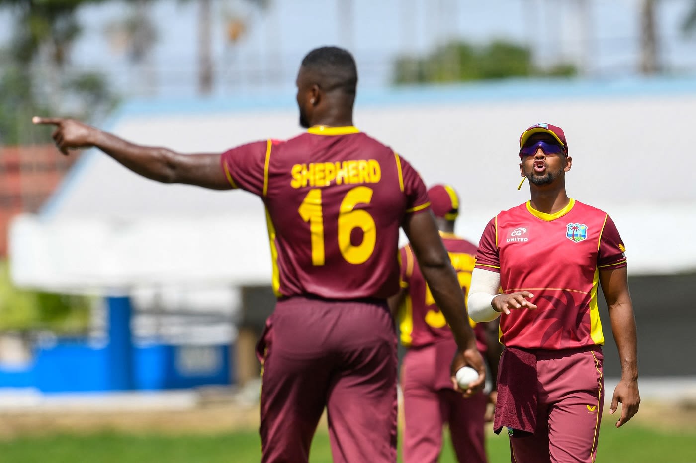 Romario Shepherd asks his captain Nicholas Pooran for a field change ...