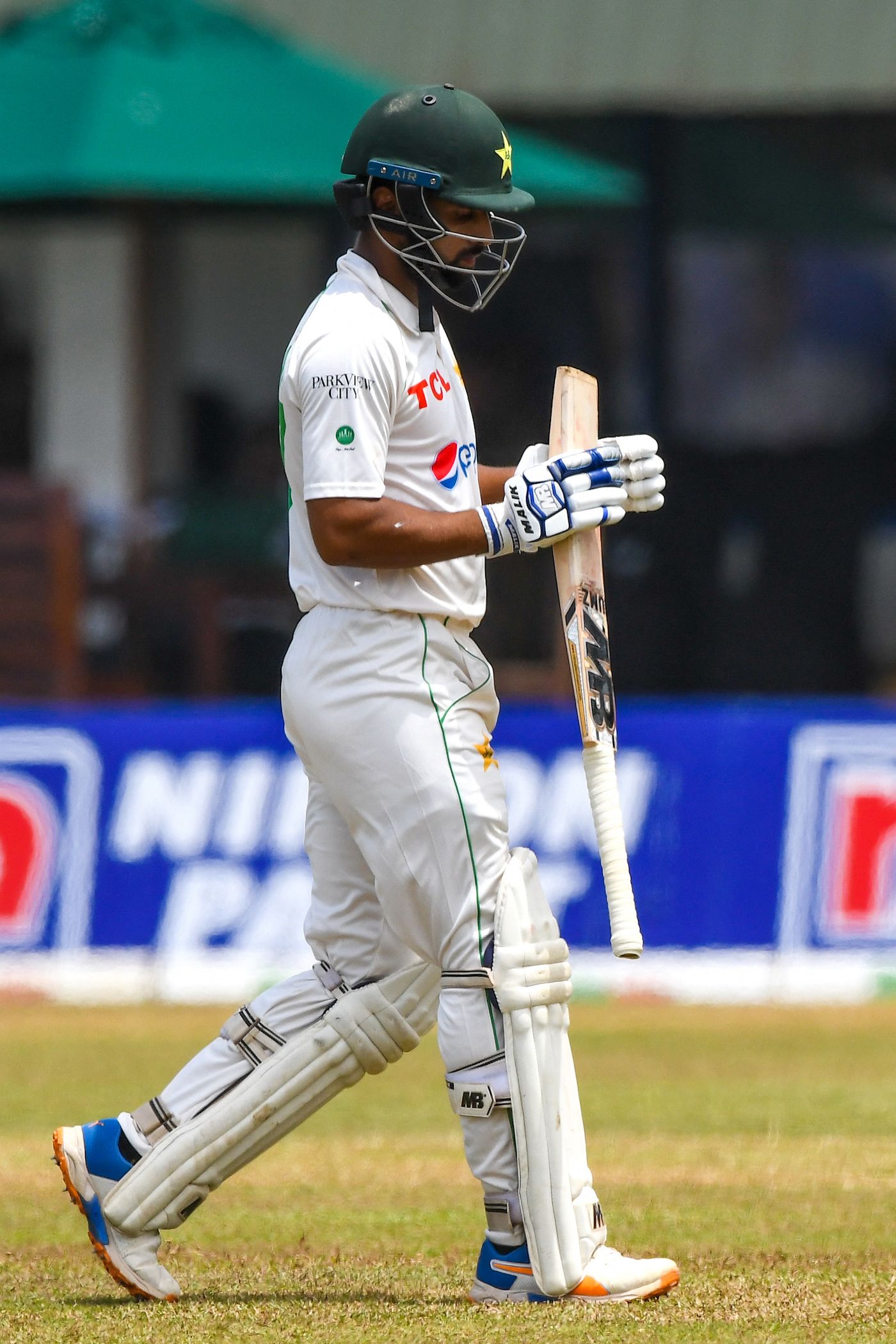 Abdullah Shafique walks back after being dismissed early | ESPNcricinfo.com