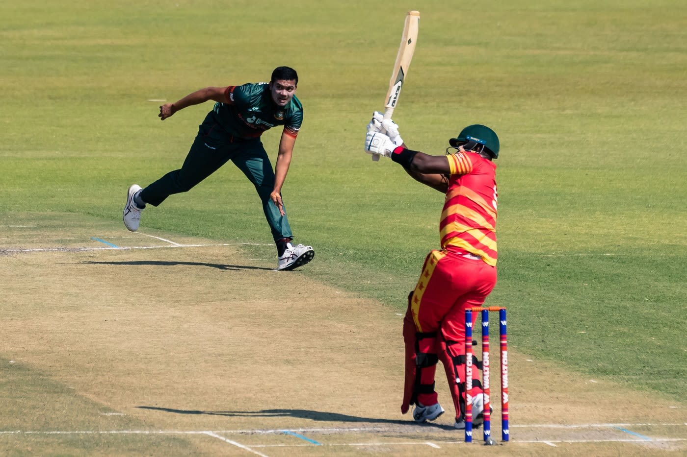 Innocent Kaia hits one through the legside as Taskin Ahmed looks on | ESPNcricinfo.com