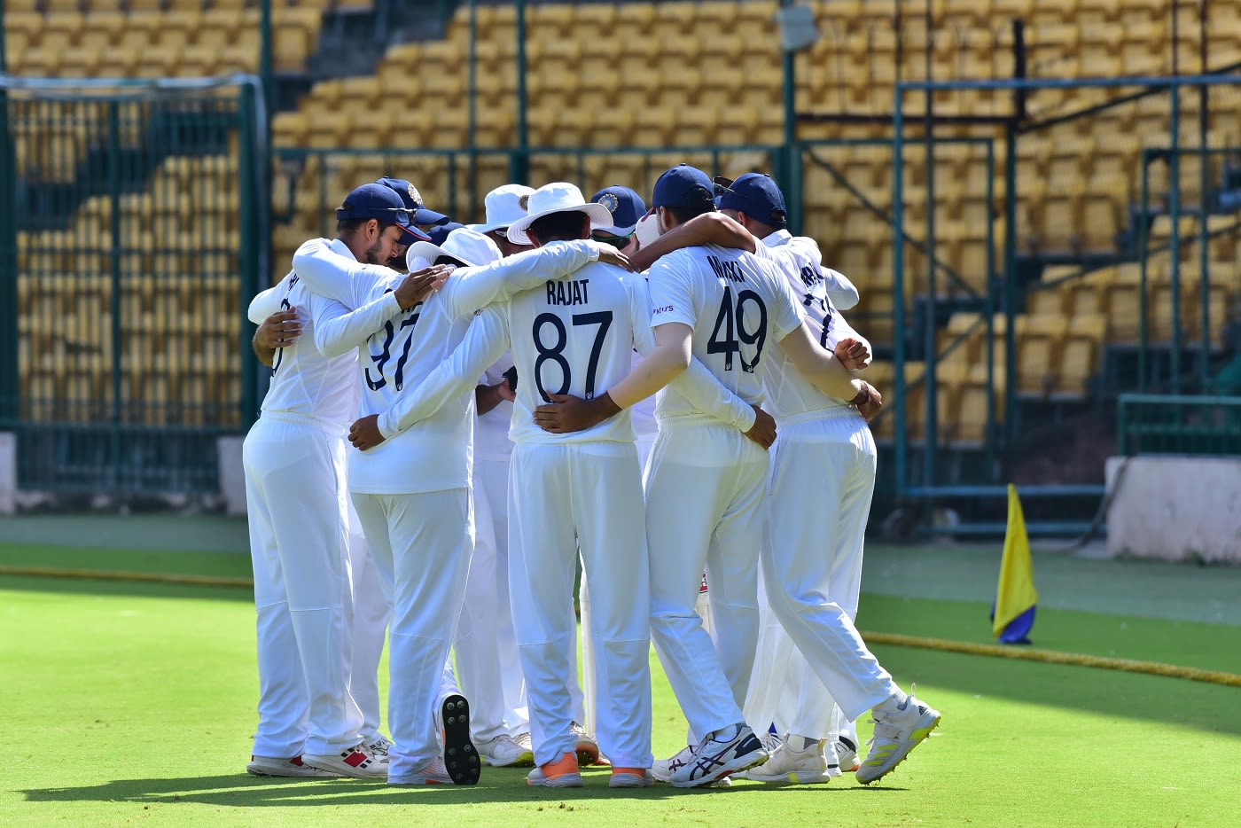 The India A players in a huddle before the start of play on the second ...