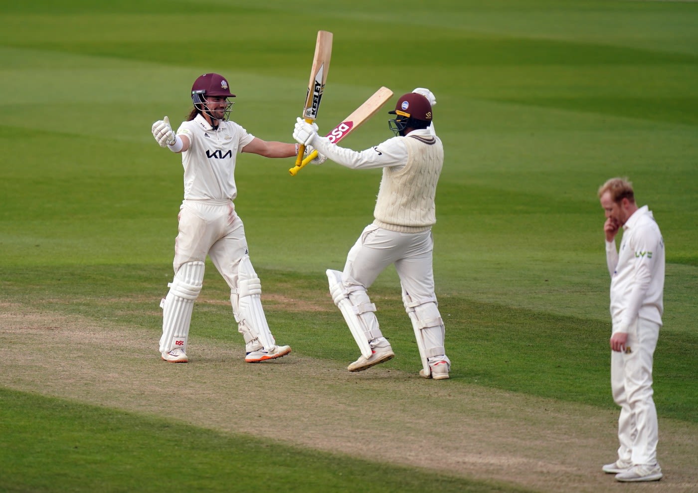 Rory Burns and Ryan Patel celebrate the moment of Championship victory ...