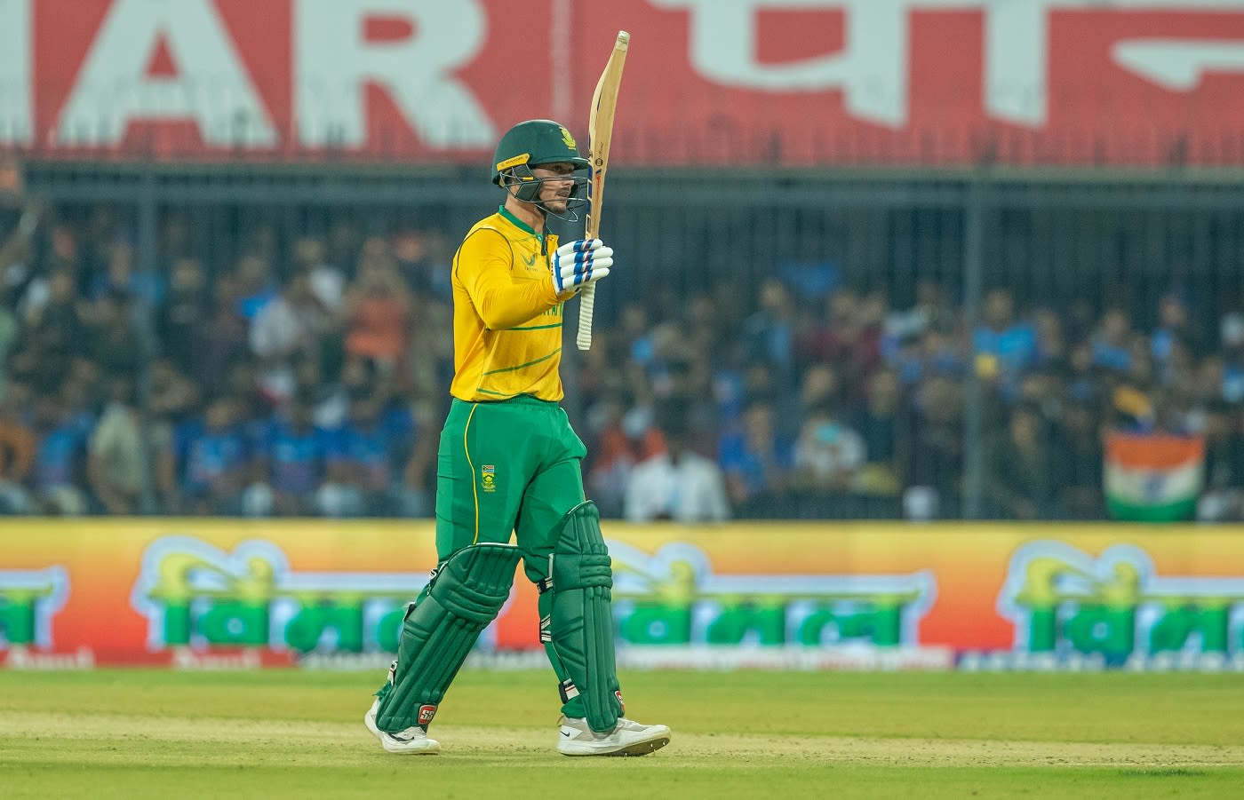 Quinton de Kock raises his bat after reaching his half-century ...