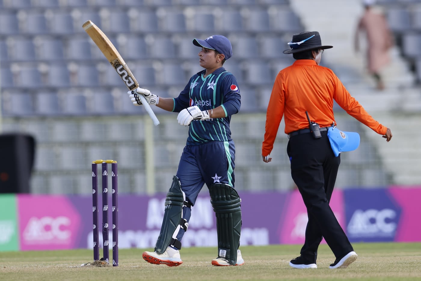 Nida Dar raises her bat after reaching her sixth T20I fifty ...