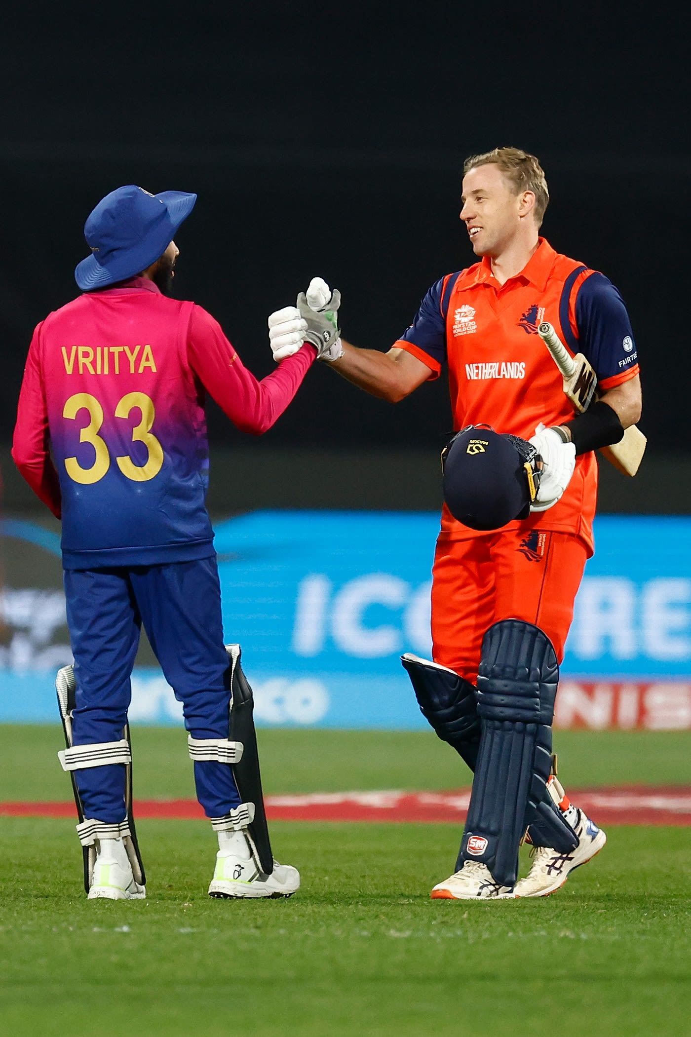 Logan van Beek catches up with Vriitya Aravind at the end of the game ...