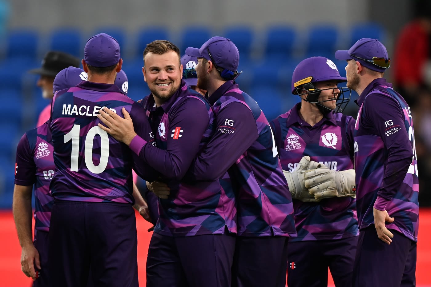 Mark Watt celebrates with his team-mates after running Akeal Hosein out ...