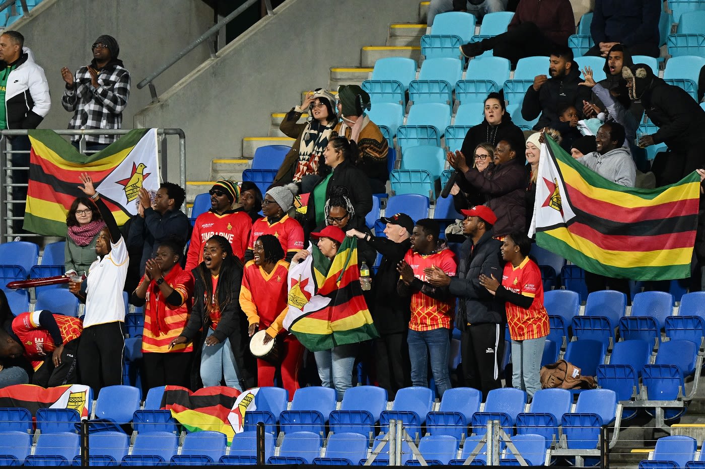 The Zimbabwe fans braved the cold and rain to get behind their team ...