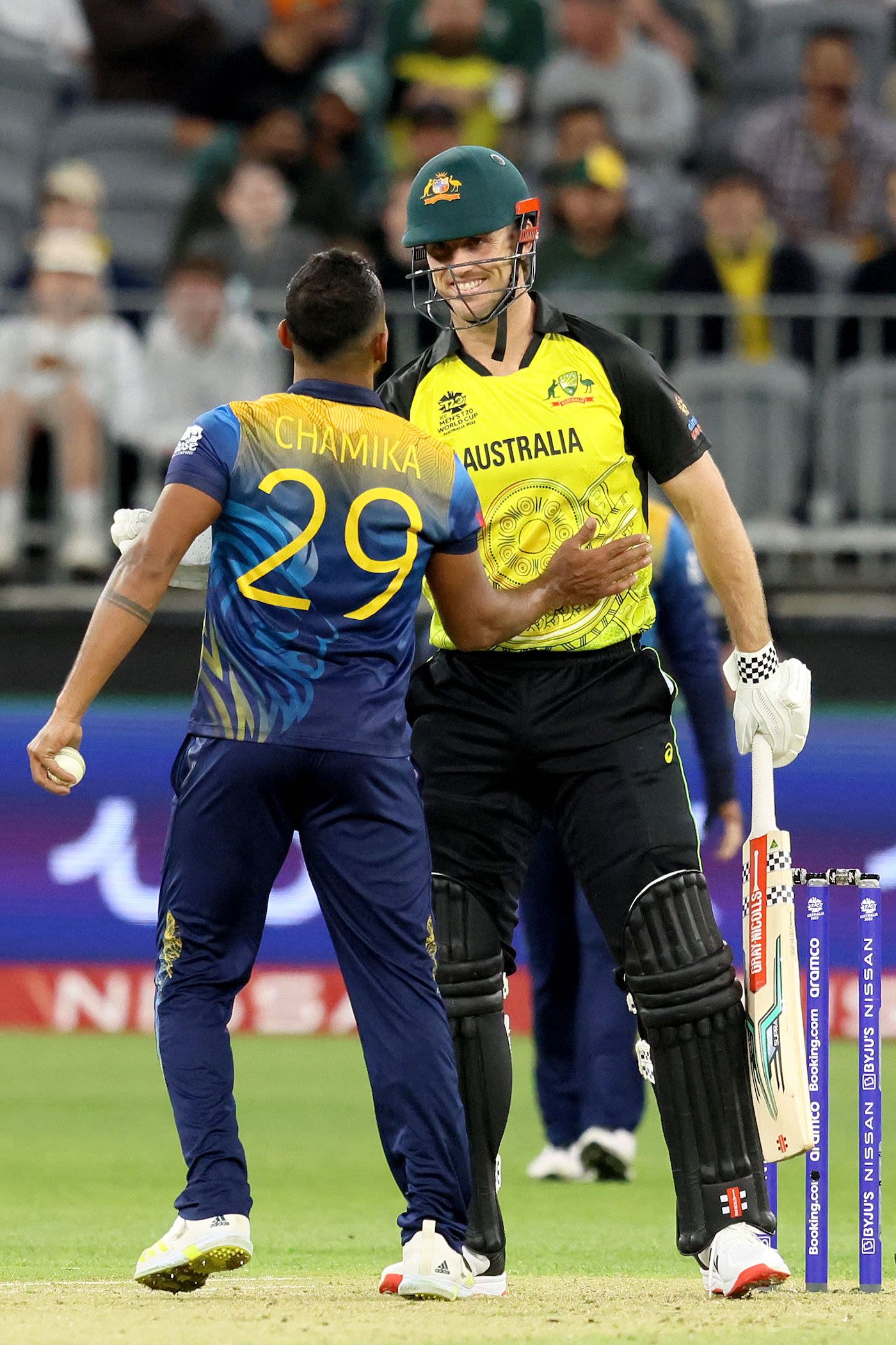 Chamika Karunaratne and Mitchell Marsh exchange pleasantries ...