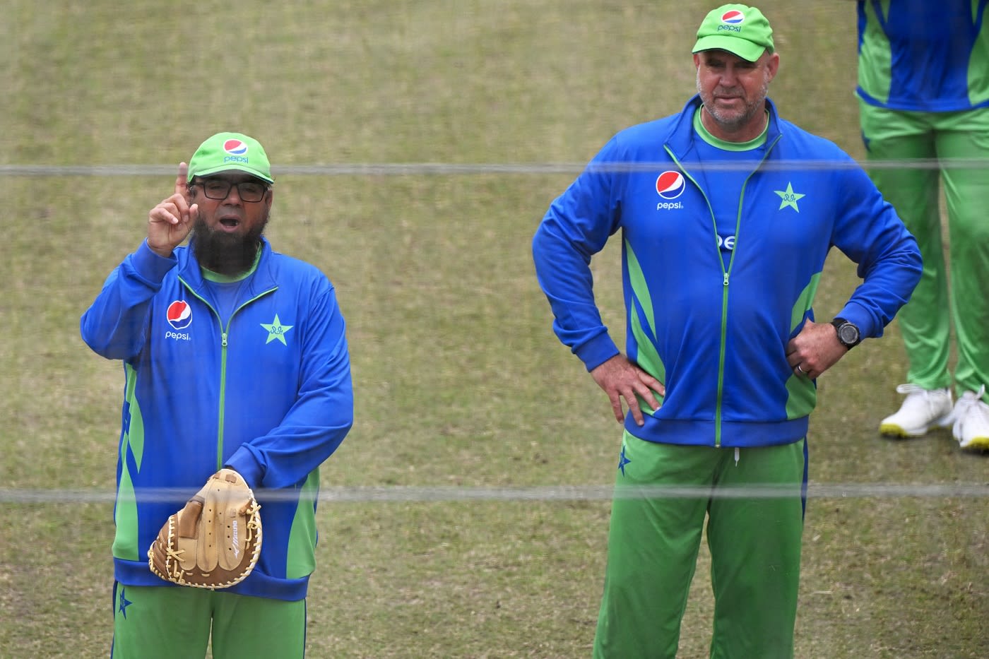 Matthew Hayden watches on as Pakistan head coach Saqlain Mushtaq speaks ...
