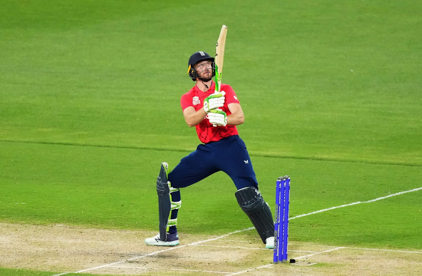 Jos Buttler scoops a length ball from Naseem Shah over fine leg ...