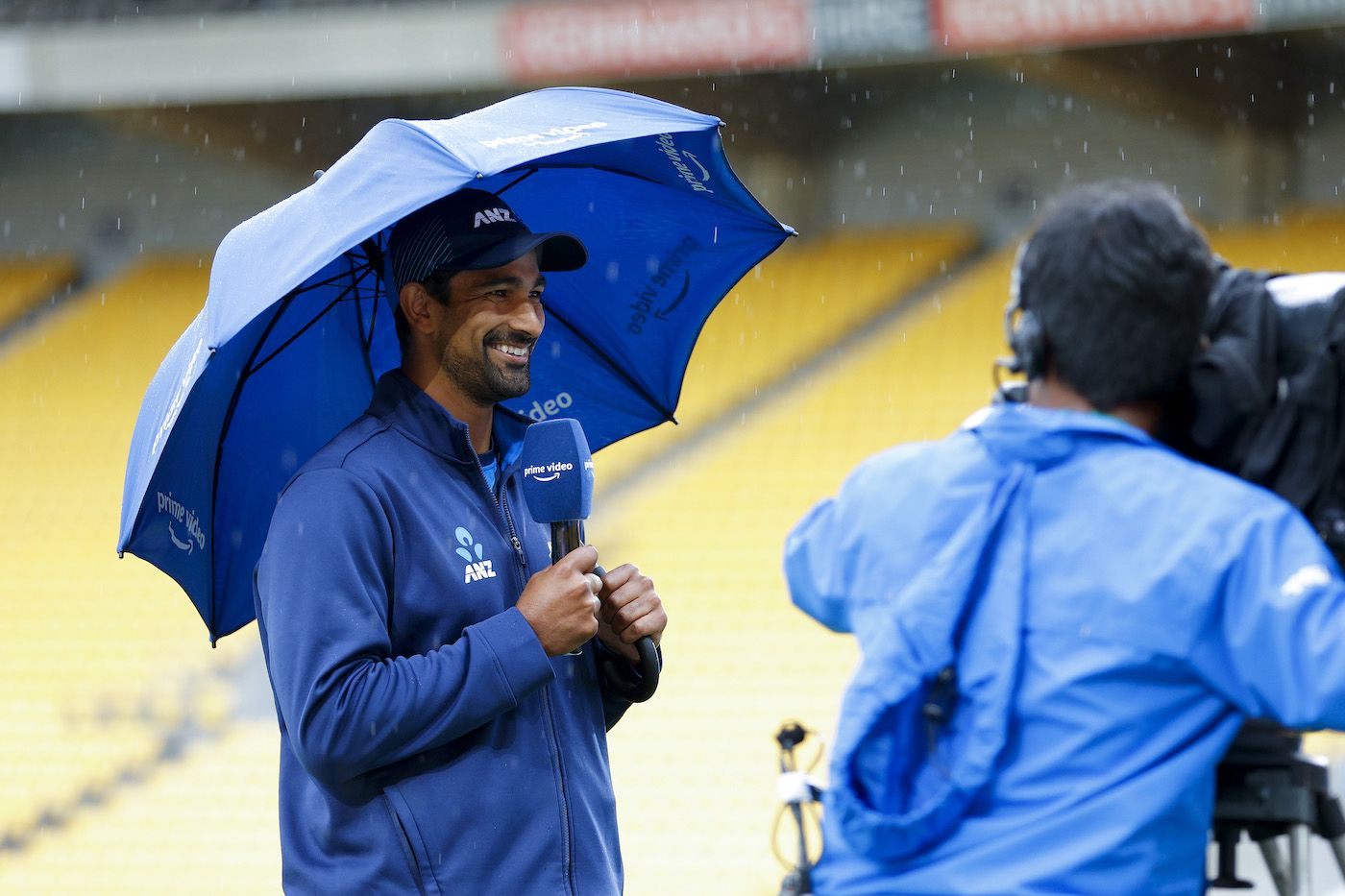 The umbrellas were out as rain pelted down | ESPNcricinfo.com