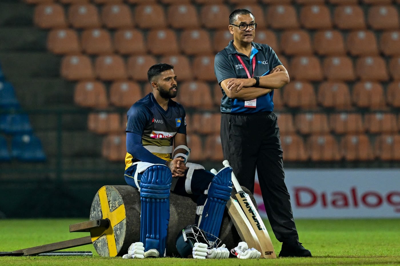 Kusal Mendis and ICC match referee Ranjan Madugalle observe a practice ...
