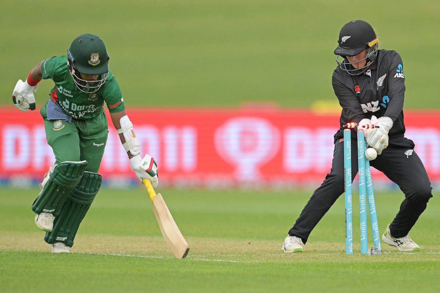 Fargana Hoque completes a run even as Jess McFadyen whips the bails off ...