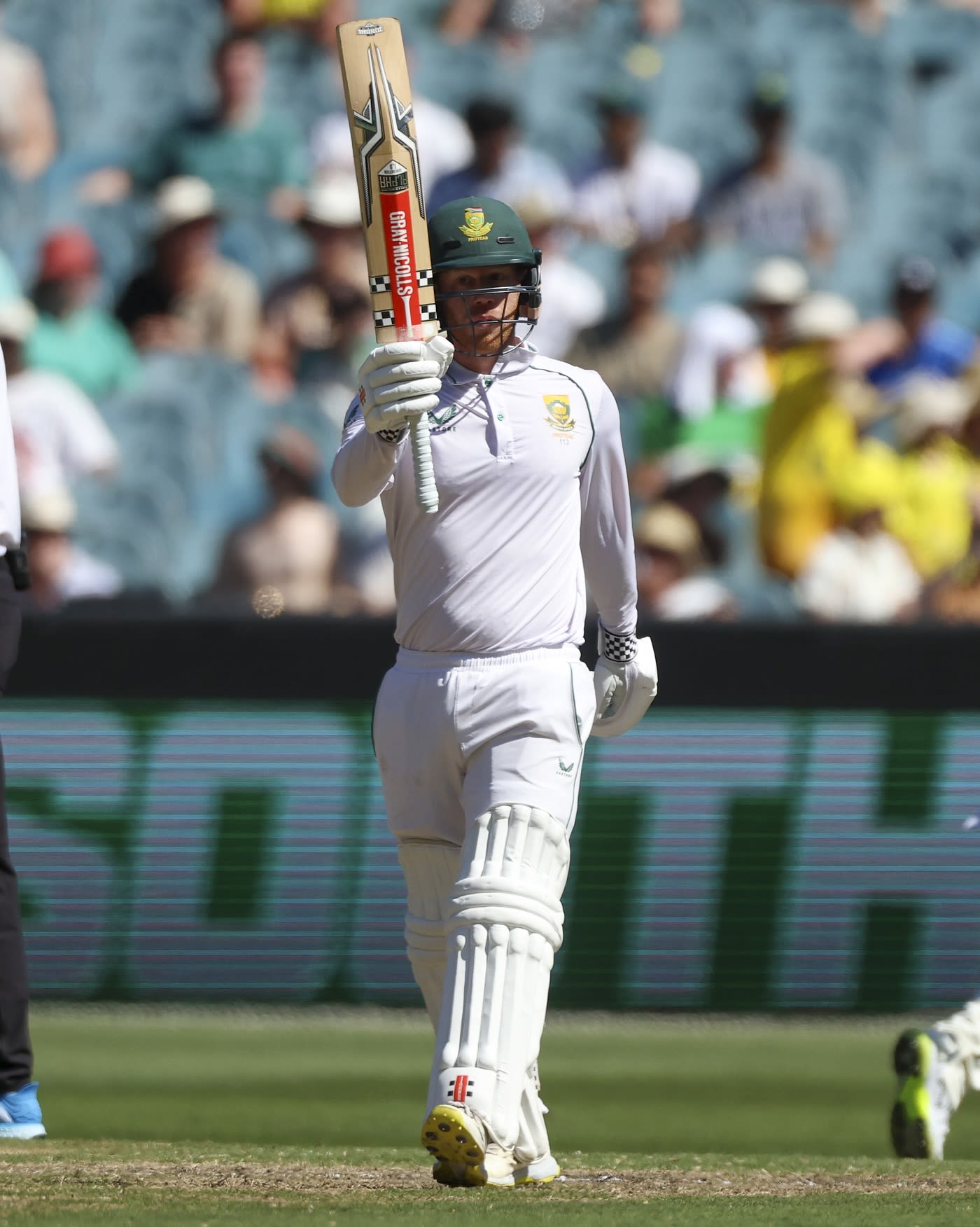 Kyle Verreynne raises his bat after reaching his half-century ...