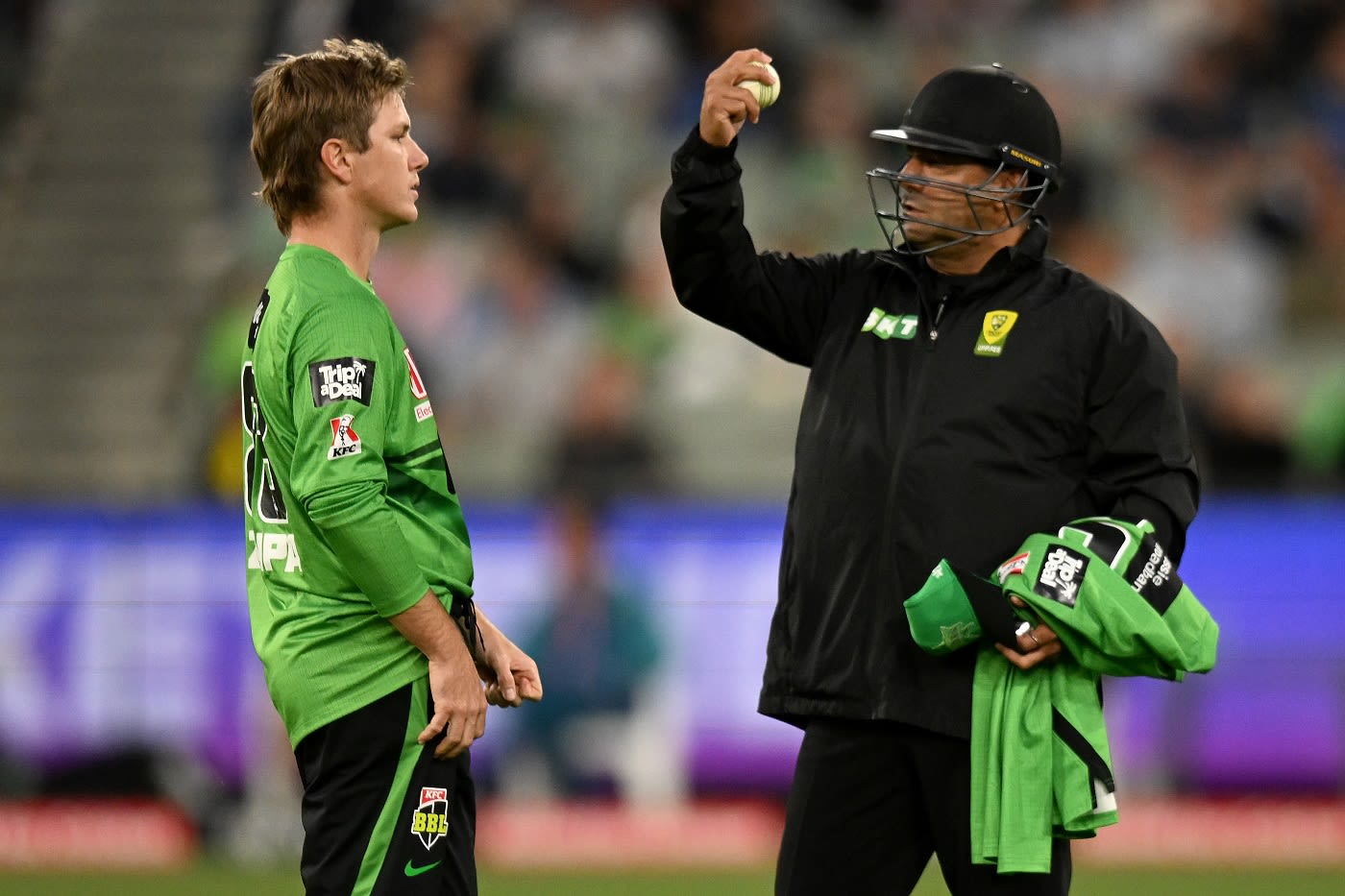 Adam Zampa and umpire Gerard Abood have a chat after the former's run ...