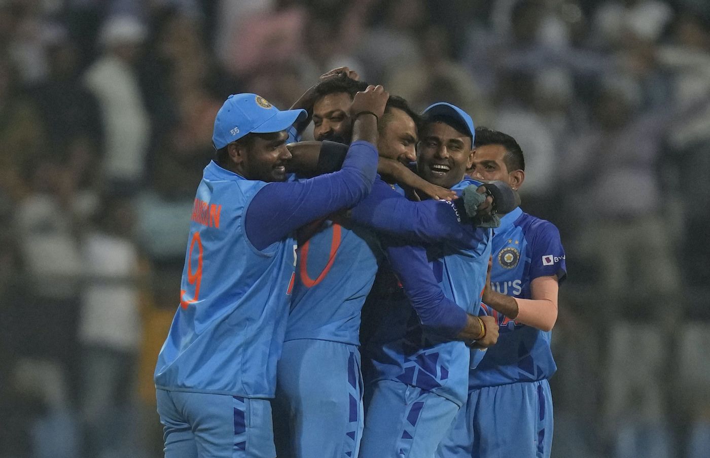 Suryakumar Yadav and Hardik Pandya hug Axar Patel with Sanju Samson joining in the winning ...