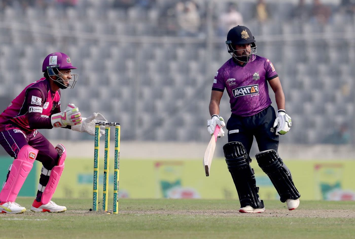 Al-Amin takes a run as Mushfiqur Rahim sets up to receive a throw ...