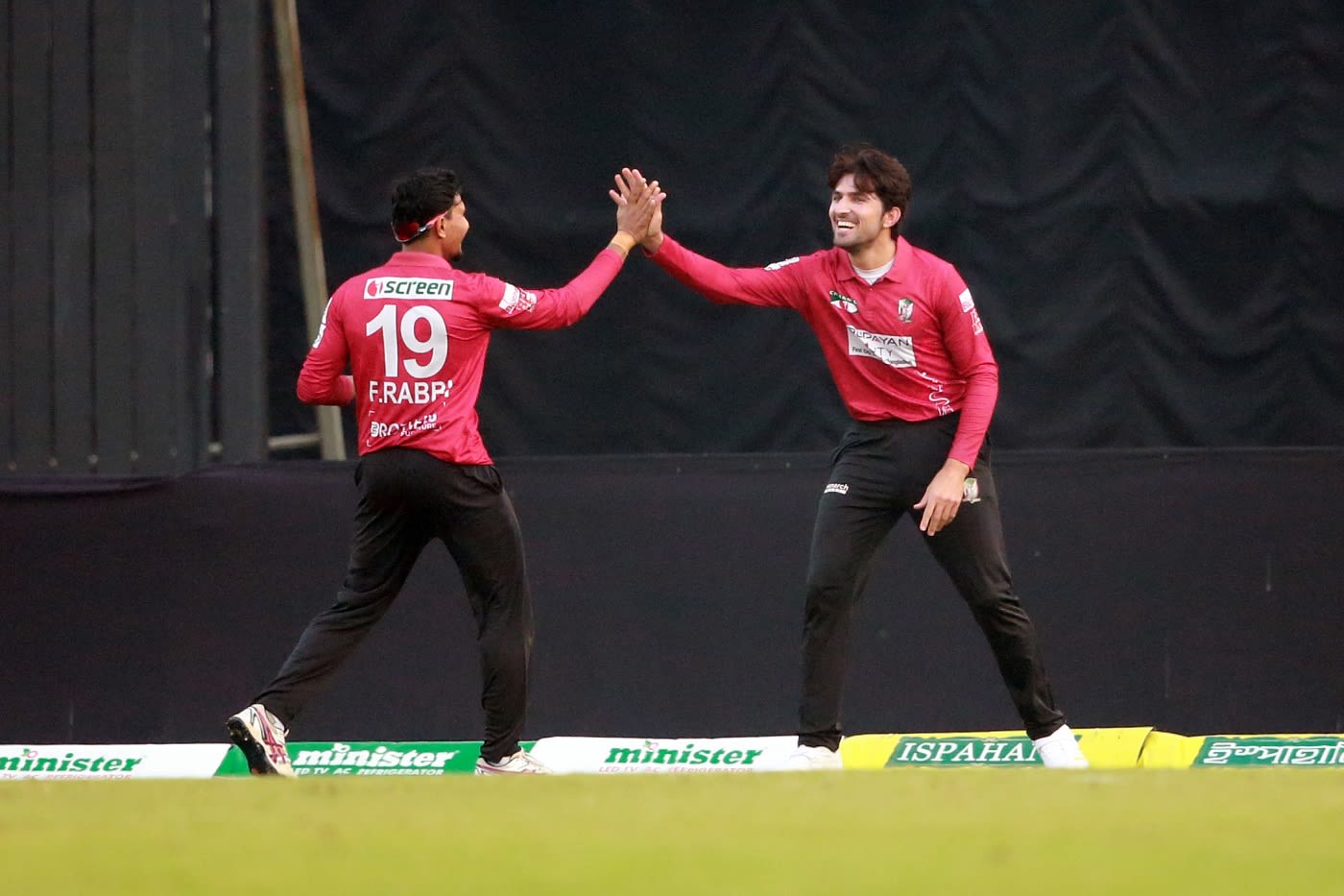 Mohammad Wasim celebrates a catch with a team-mate | ESPNcricinfo.com