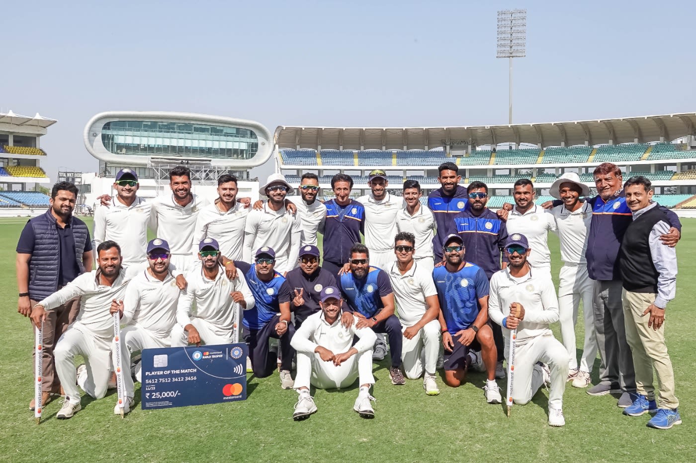 The Saurashtra players and support staff pose after their win ...
