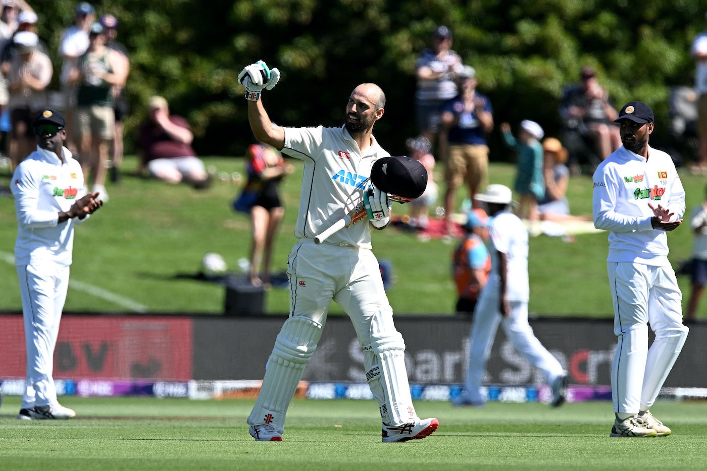 Daryl Mitchell gestures after bringing up his century | ESPNcricinfo.com