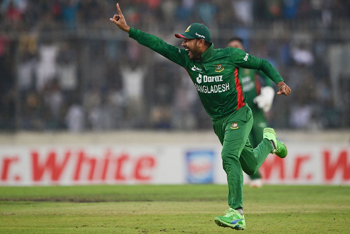 Mehidy Hasan Miraz celebrates his direct hit to run out Jos Buttler ...