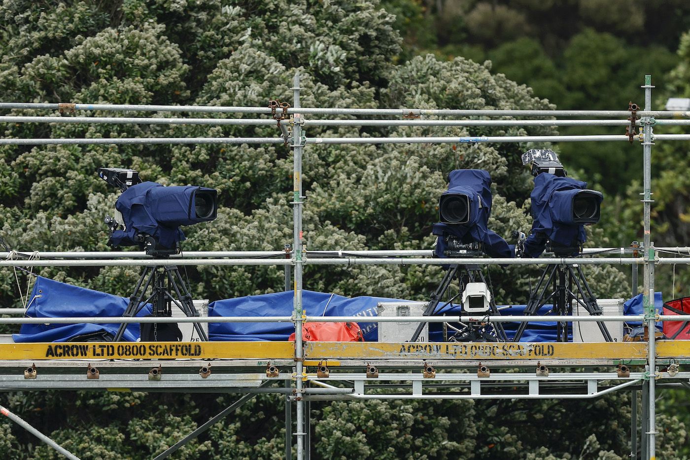 TV cameras sit abandoned on top of the scaffolding due to strong winds ...