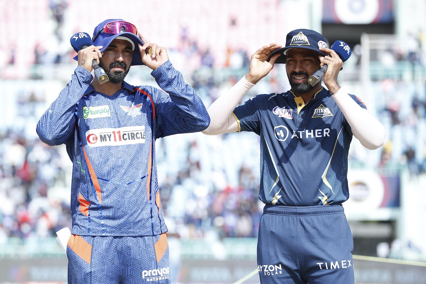 KL Rahul and Hardik Pandya look to shield themselves from the heat at the toss | ESPNcricinfo.com