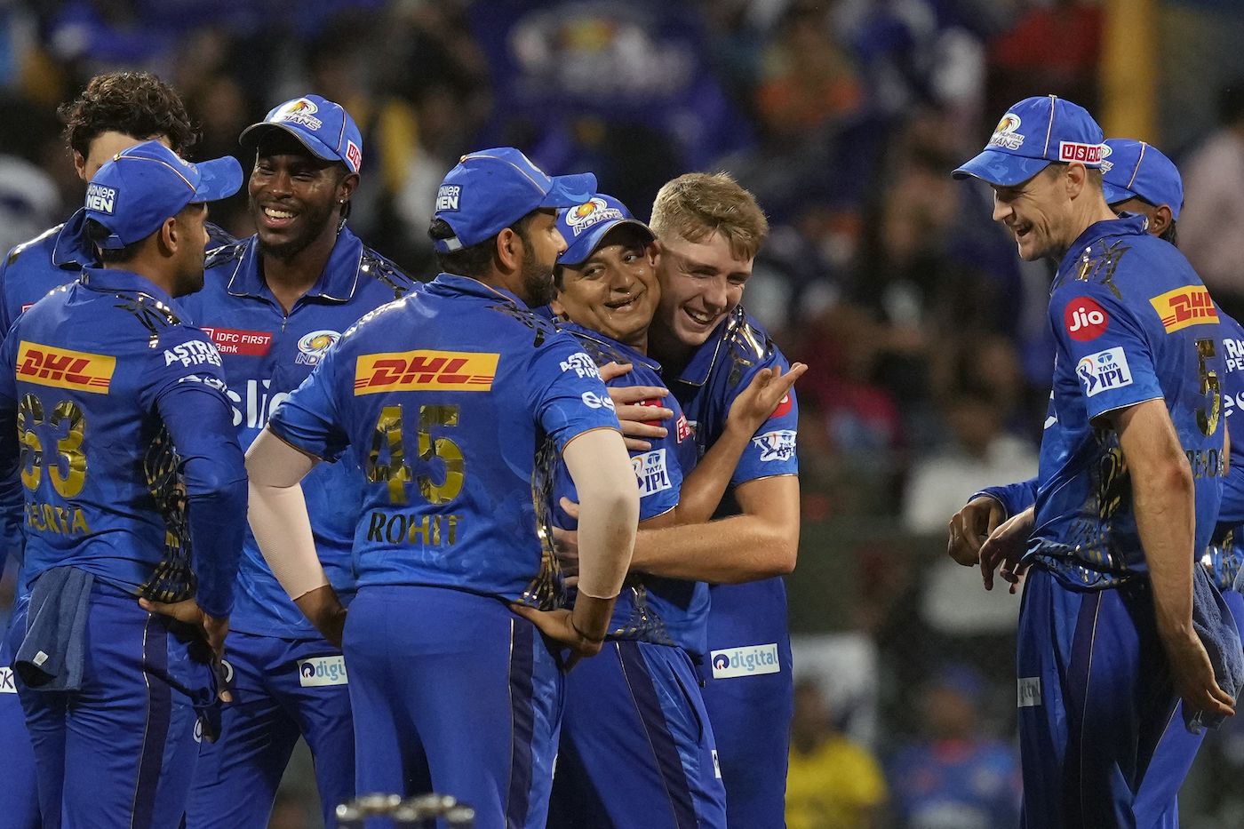 The MI players celebrate their first wicket of the game | ESPNcricinfo.com