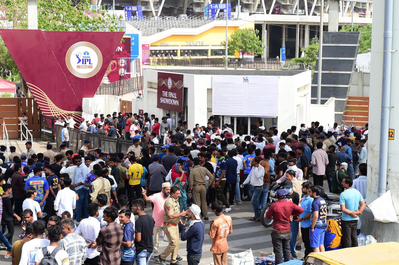 Fans arrive at the stadium early to collect their tickets ...