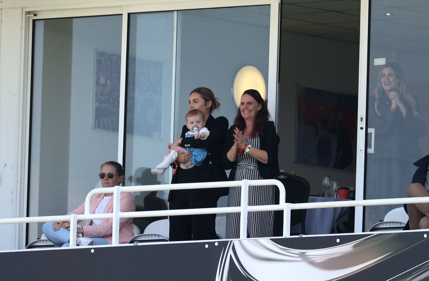 Travis Head's wife, Jessica Head, née Davies, and child watch the game ...