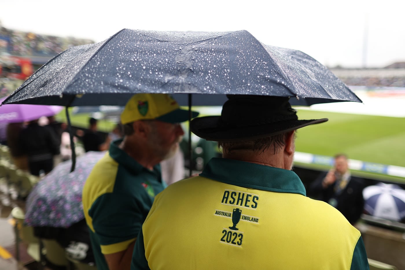 Fans wait in the rain | ESPNcricinfo.com