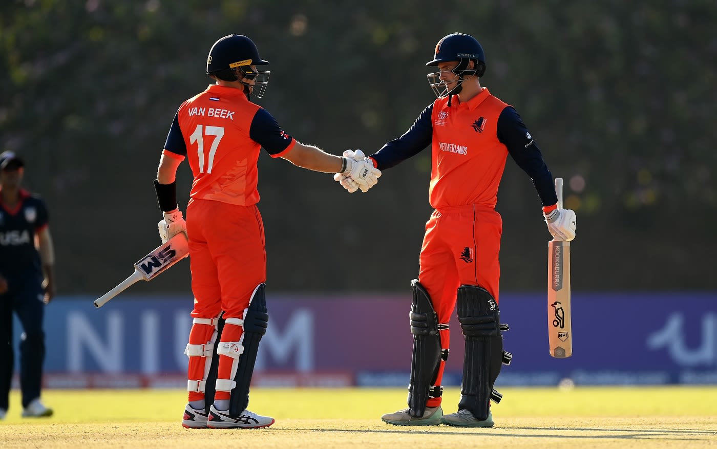 Logan van Beek congratulates Scott Edwards on completing a second ...