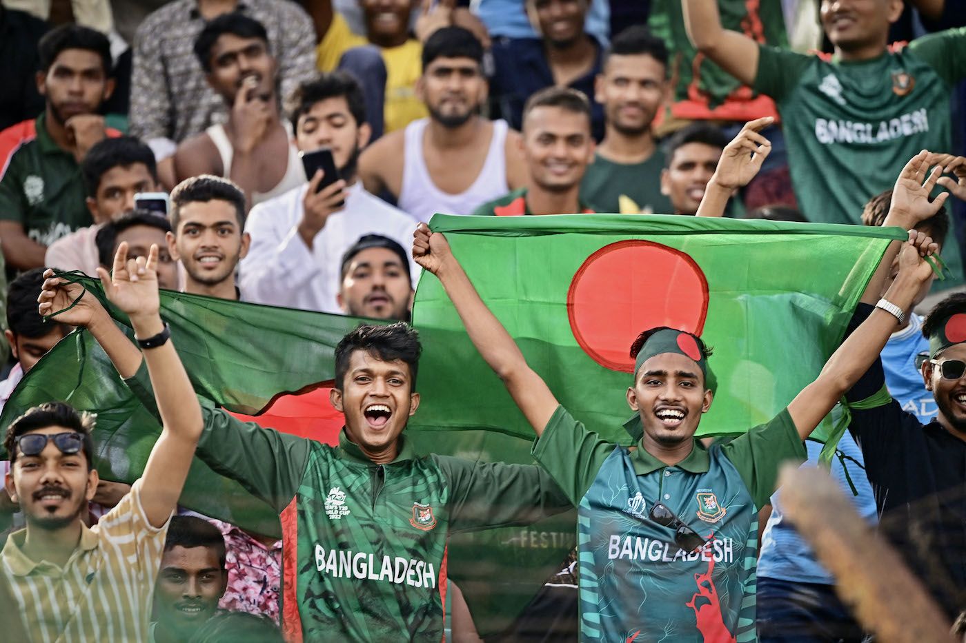 A set of happy Bangladesh fans put their support on display ...