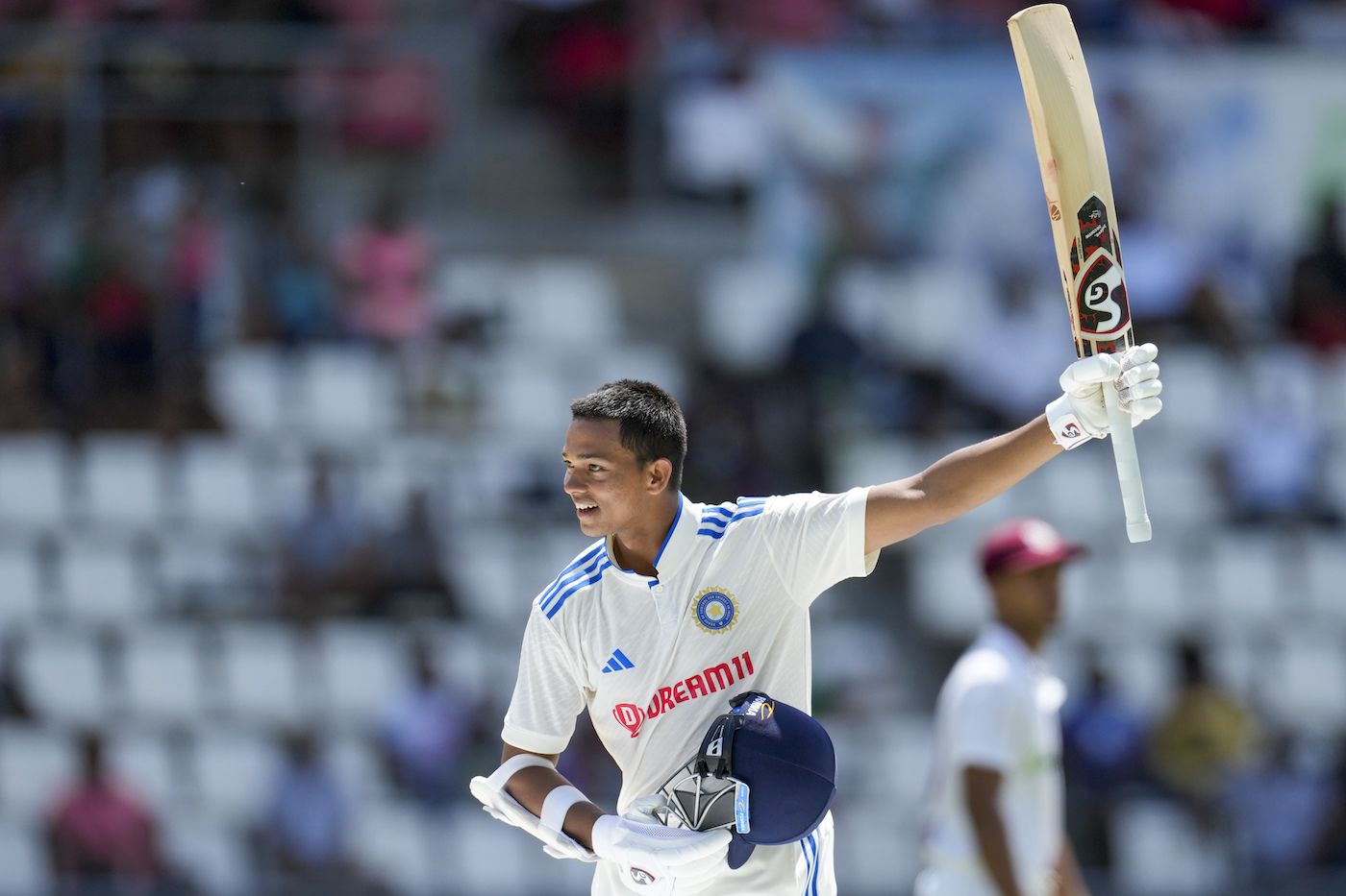 Yashasvi Jaiswal raises his bat after scoring a hundred on debut ...