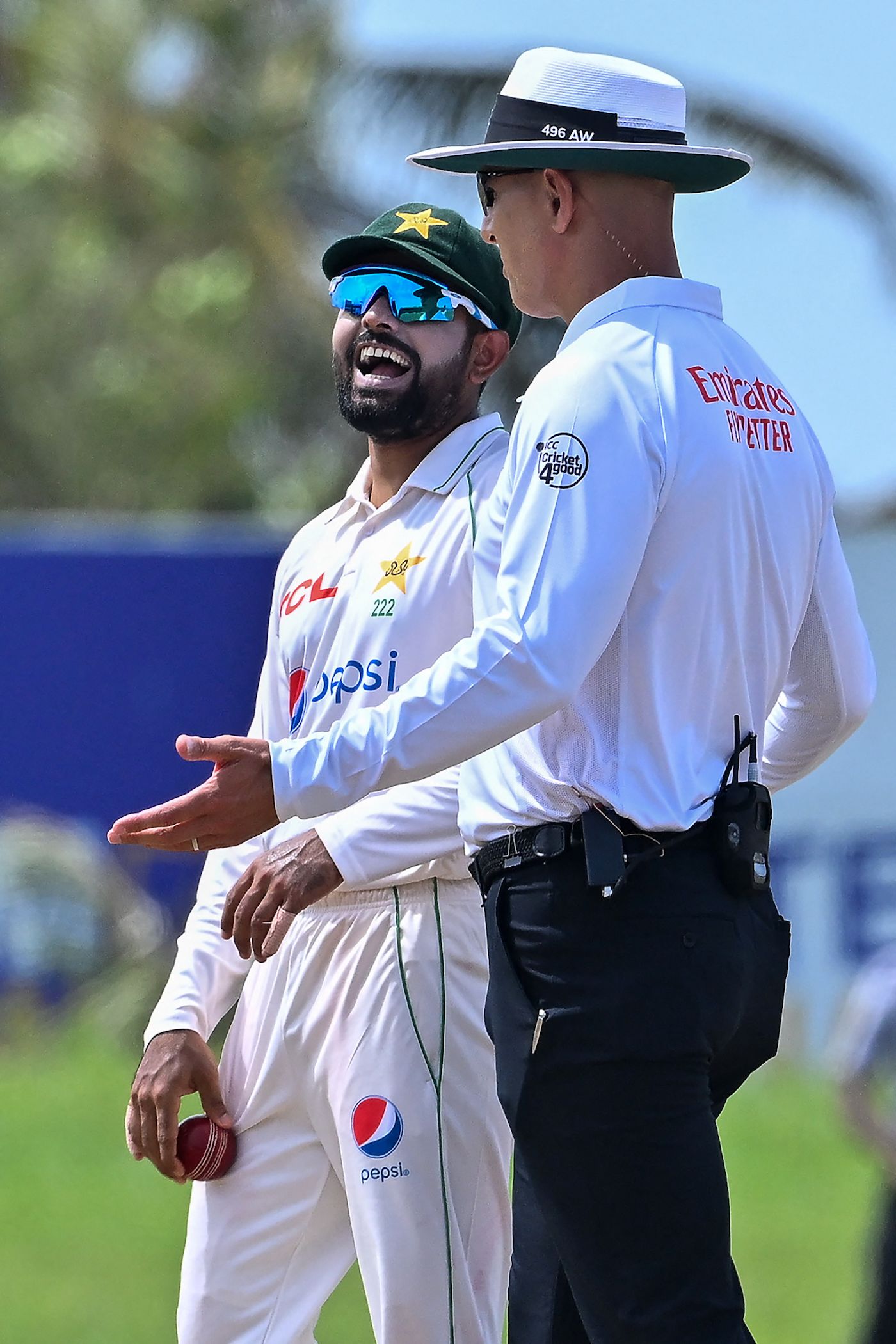 Babar Azam shares a laugh with umpire Alex Wharf | ESPNcricinfo.com