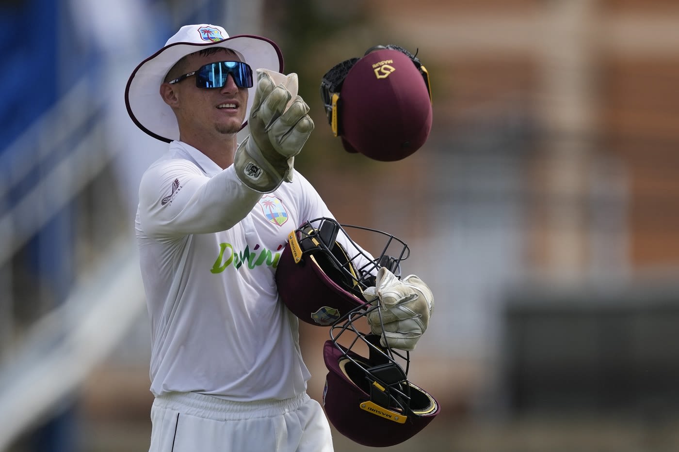 Joshua Da Silva throws a helmet to a team-mate | ESPNcricinfo.com