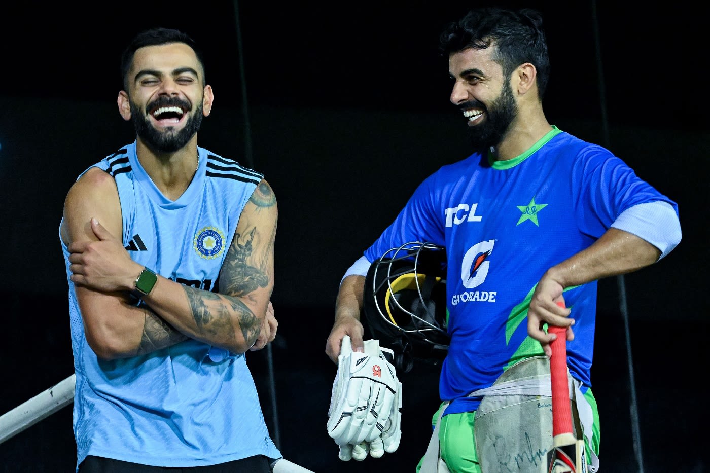 Virat Kohli and Shadab Khan share a light moment | ESPNcricinfo.com