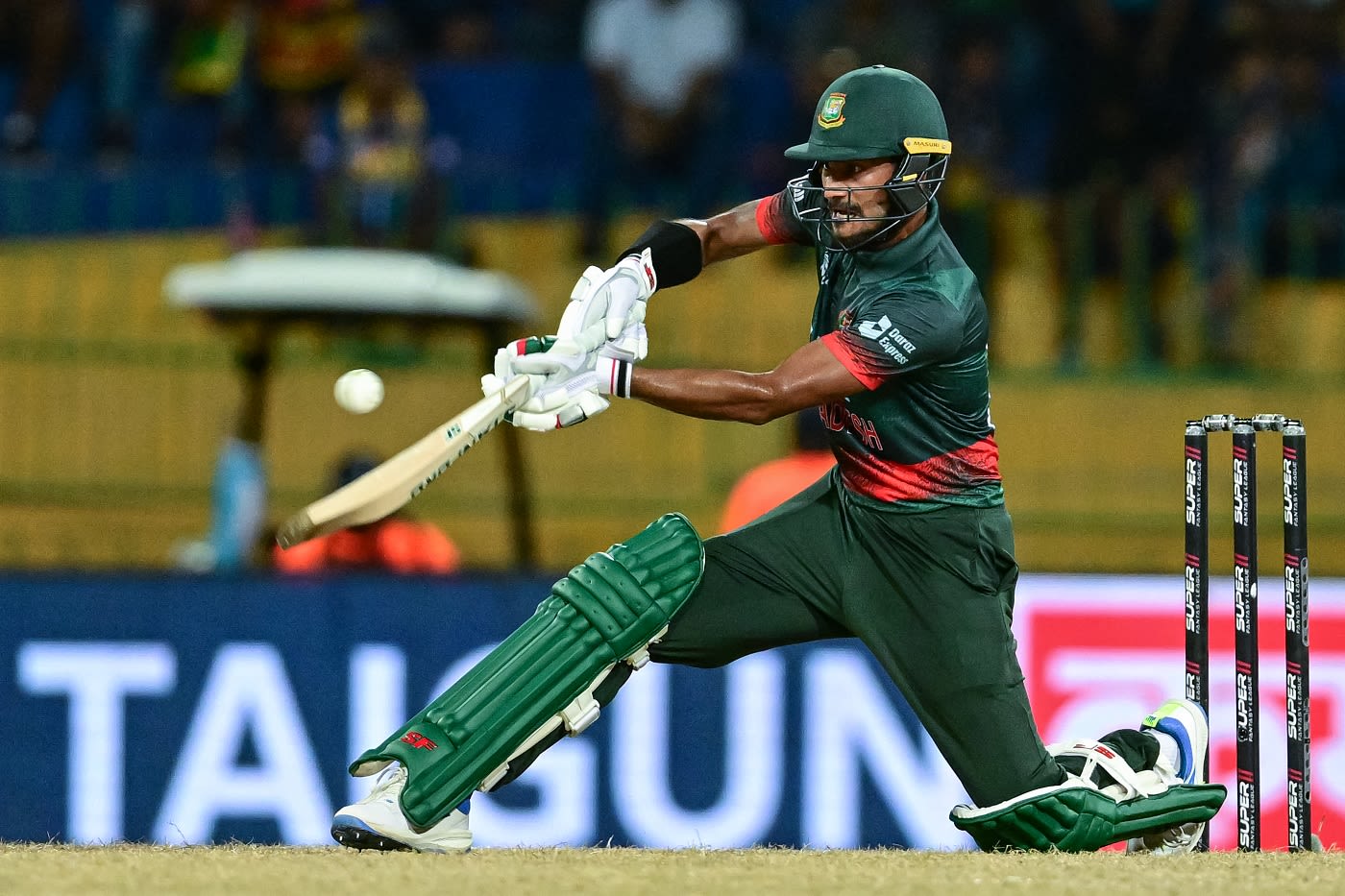 Mohammad Naim launches into a sweep | ESPNcricinfo.com