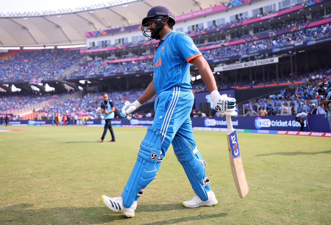 Captain Rohit Sharma walks out to bat after Australia sent India in ...