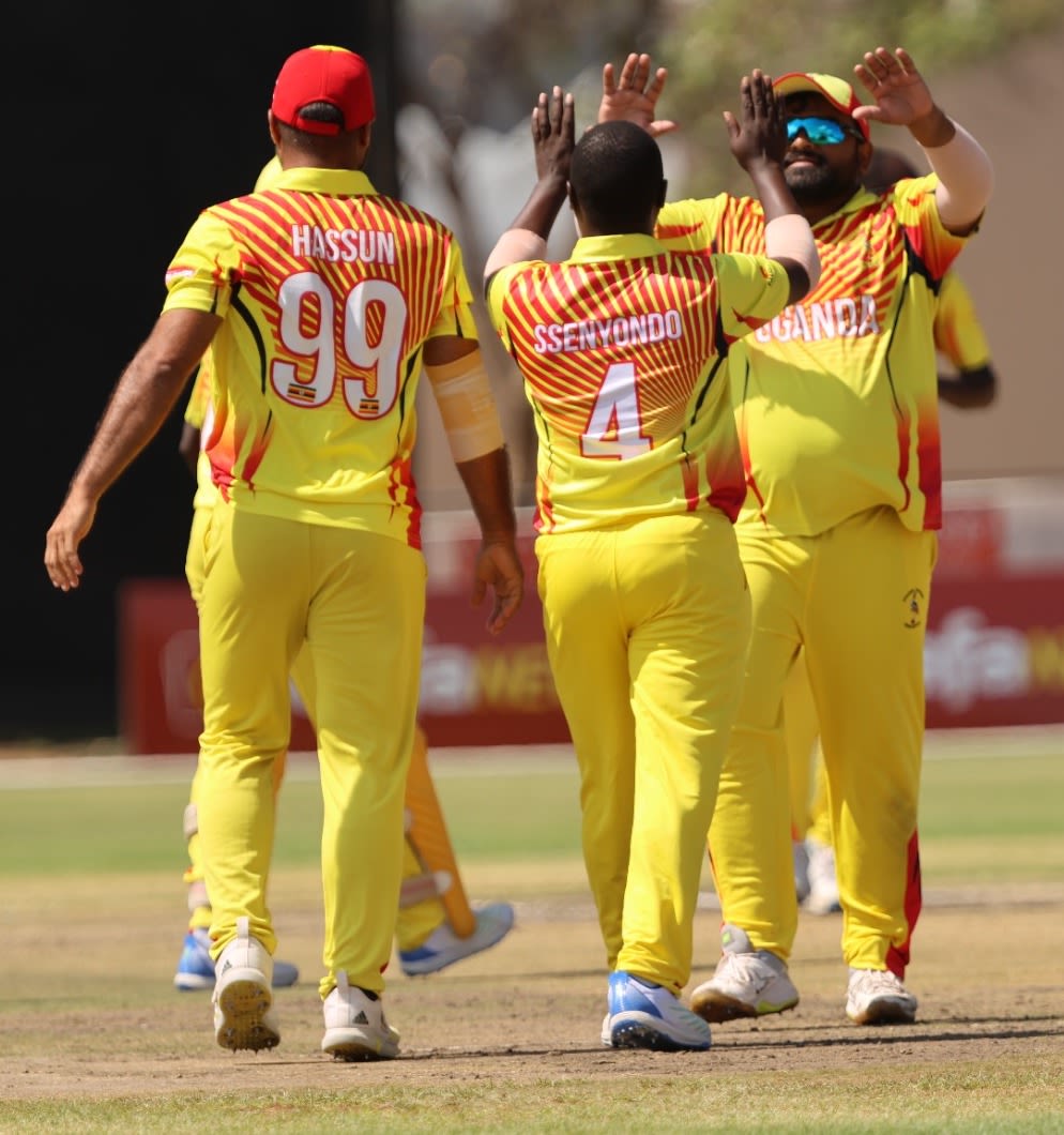 The Uganda players celebrate a wicket during their crushing win over ...