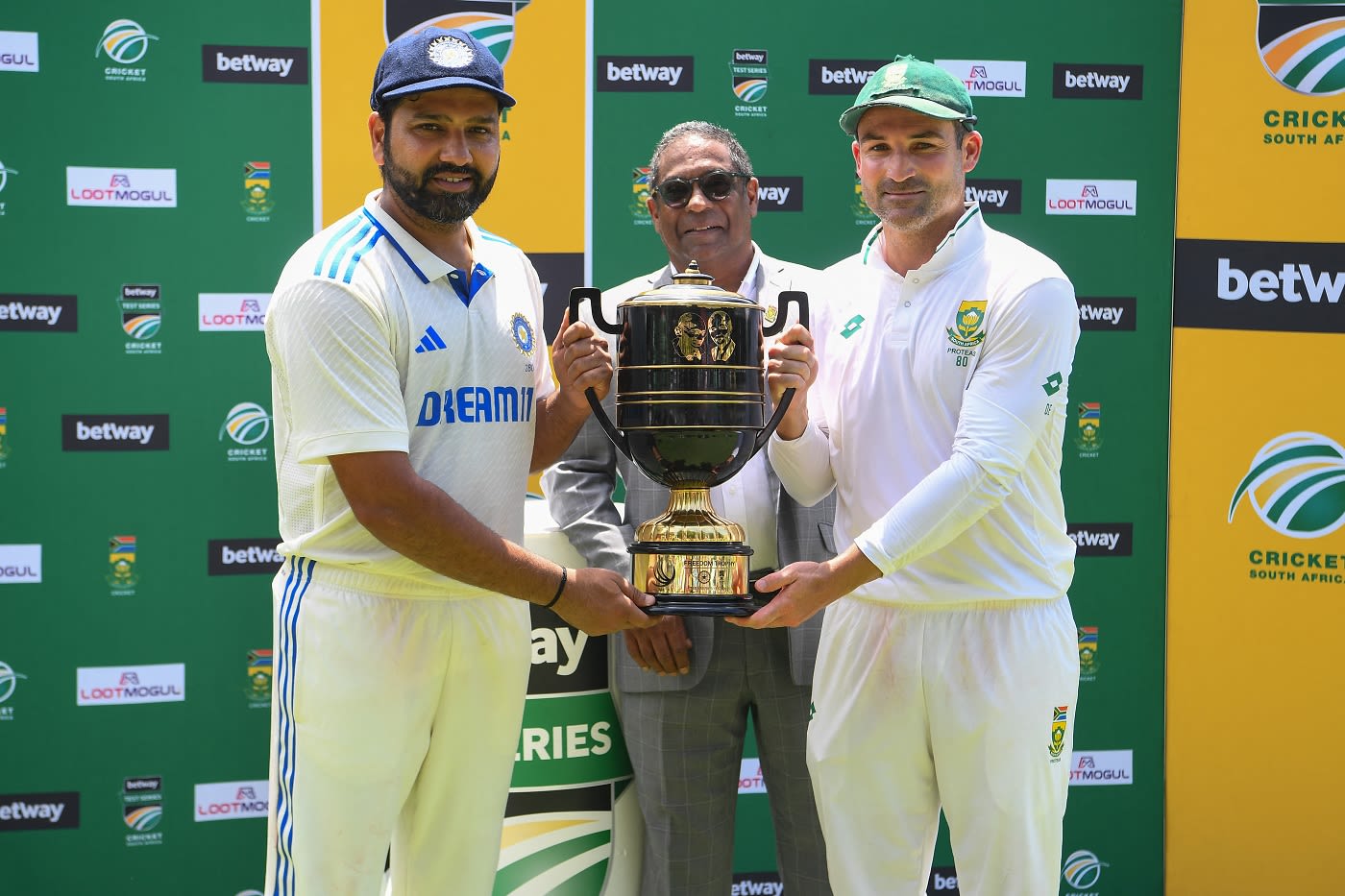 Rohit Sharma and Dean Elgar pose with the series trophy | ESPNcricinfo.com