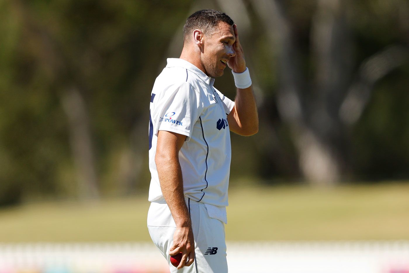 Scott Boland left the field with what appeared to be an injury ...