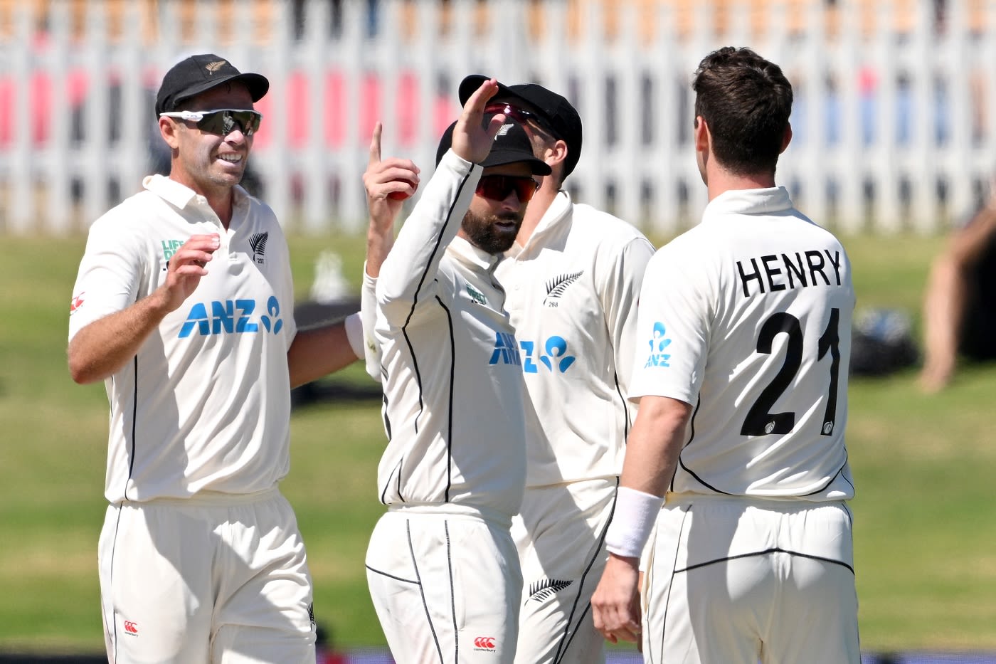 Matt Henry is congratulated by his team-mates after he removed David ...